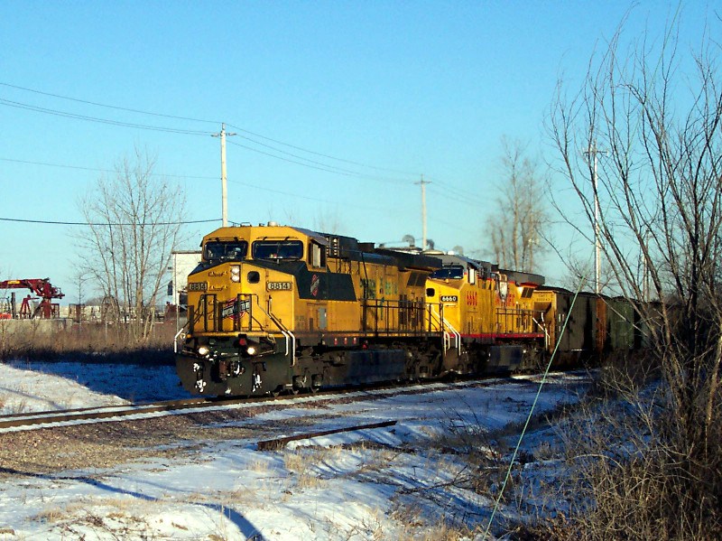 CNW 8814 leads a Wisconsin Rapids coal train west from Butler